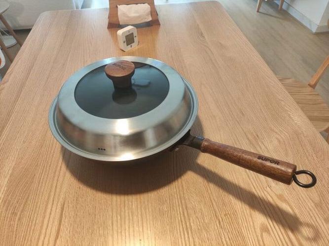 苏泊尔生铁锅涂层需要刮掉再使用吗图标
