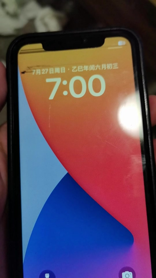 手机屏幕边缘有个黑点图标