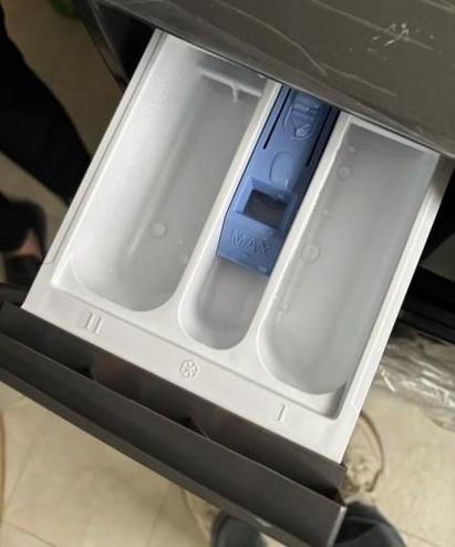 海尔洗衣机排污口打开图解图标